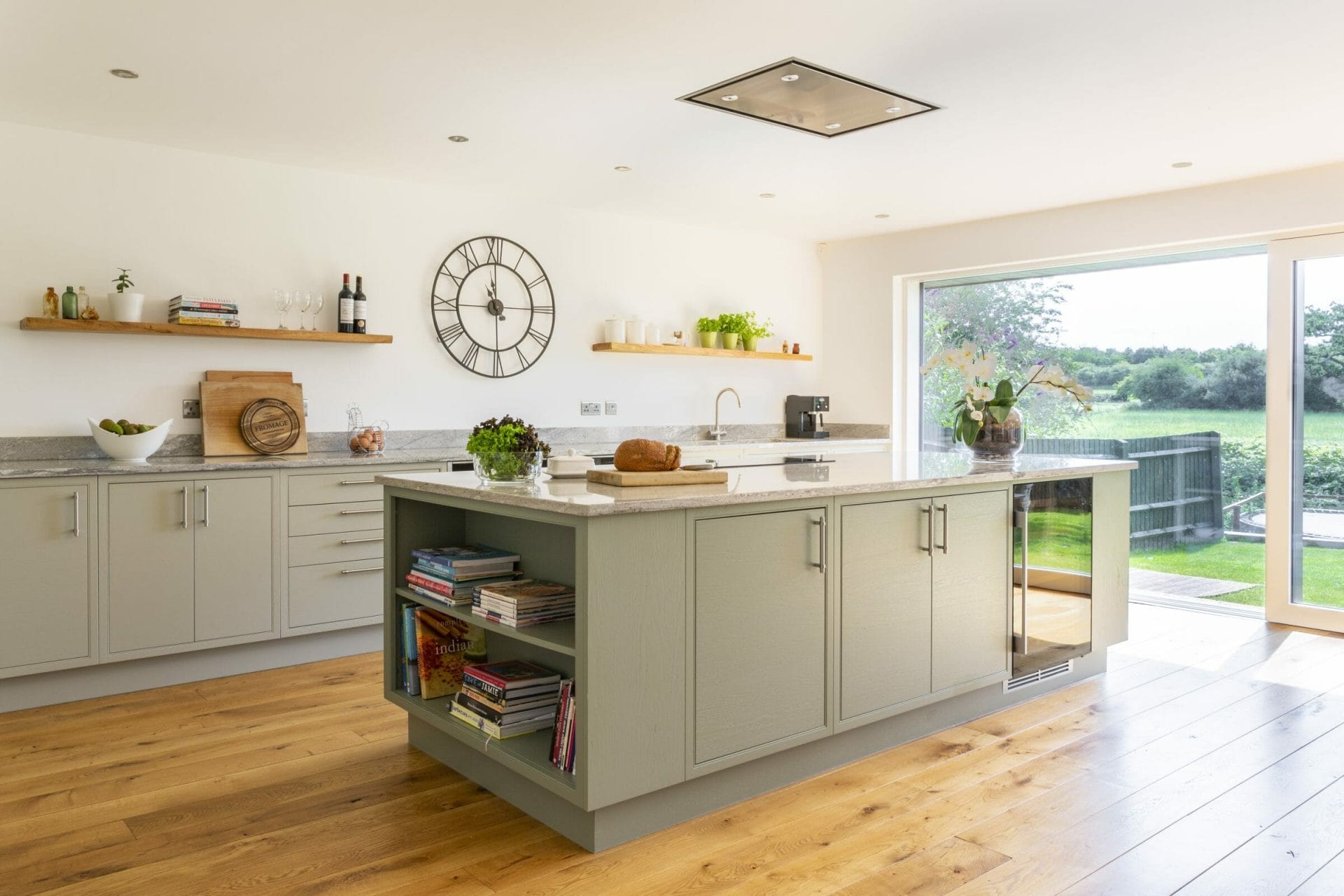 Light green painted in frame kitchen and dining area - Classic Interiors