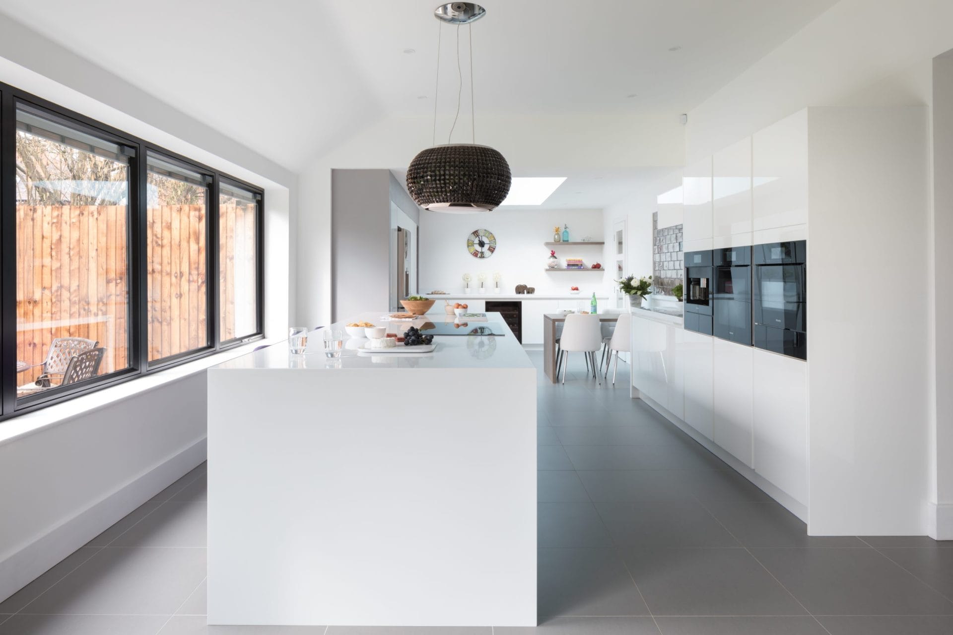 Open Plan Grey and White Handleless Kitchen - Classic Interiors