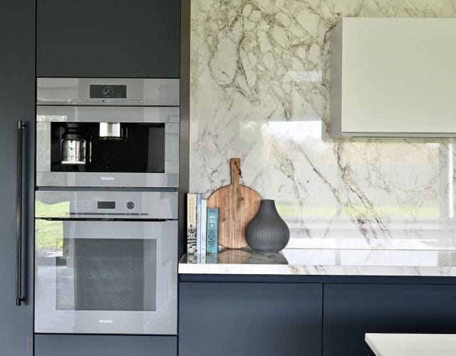 Stunning Navy Blue Kitchen with Marble Splashback - Classic Interiors