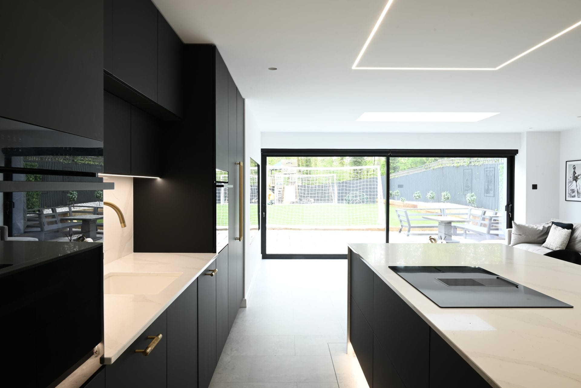 Modern Black German Kitchen with Brass Handles - Classic Interiors